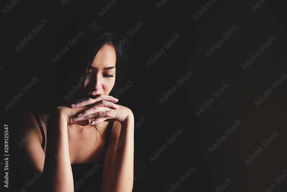 Sad depressed woman suffering from family life. women sitting in dark ...