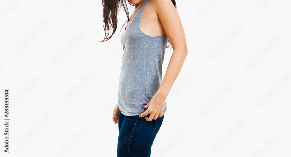 Side view of slender attractive brunette woman in heathered gray tank ...