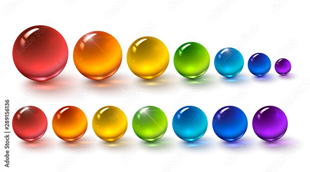 Set of multi-colored glass balls on a white background, round drops of ...