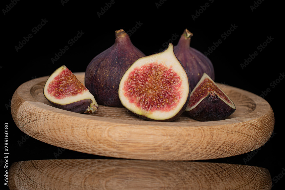 Group of two whole one half two slices of meaty fresh fig fruit on ...