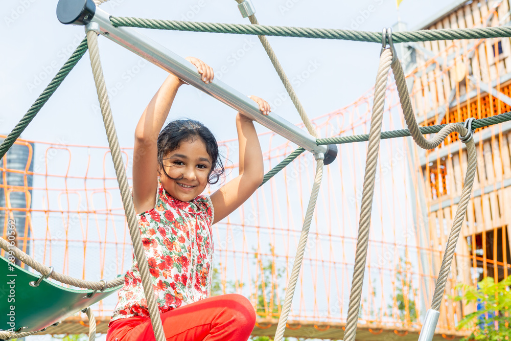 Little Girl Playing on Bars and Ropes in a Playground Stock Photo ...