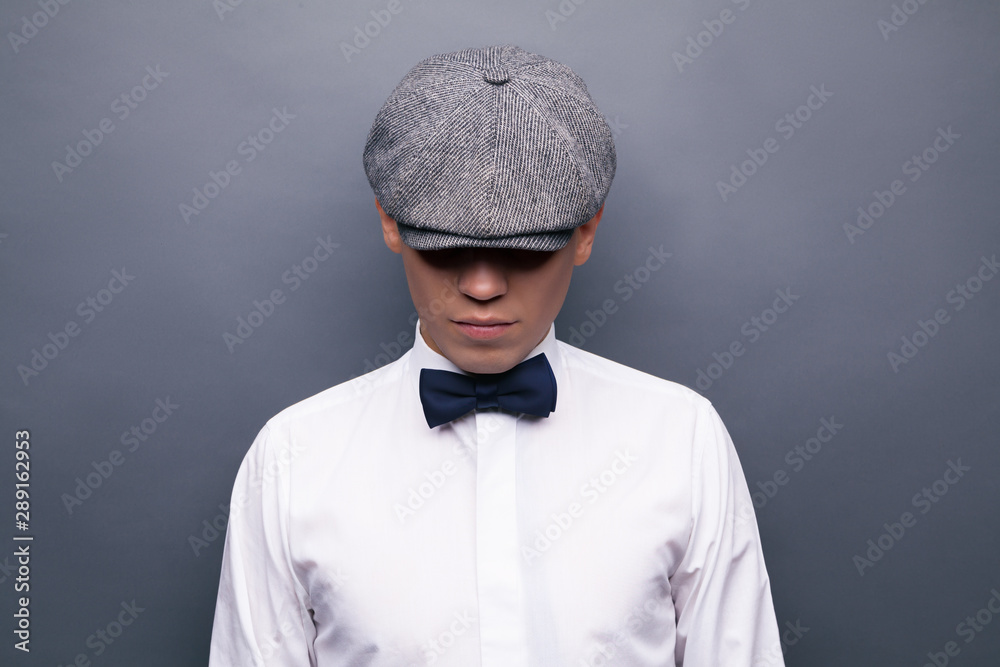 Mysterious portrait of retro 1920s english gangster with flat cap ...