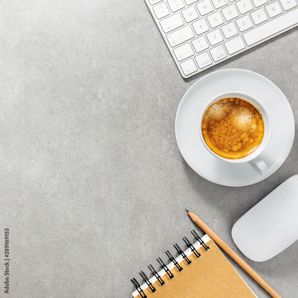 Office table with cup of coffee, keyboard and notepad Stock Photo ...