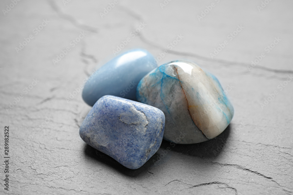 Beautiful natural blue gemstones on grey table Stock Photo | Adobe Stock