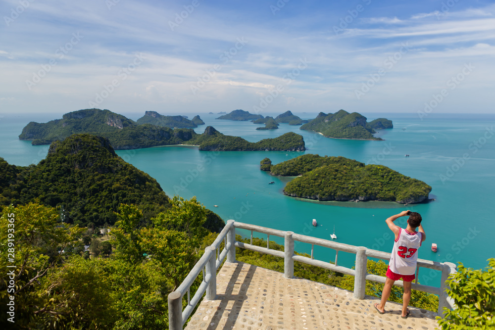 Photo & Art Print A tourist is taking a photo at viewpoint deck in Koh ...