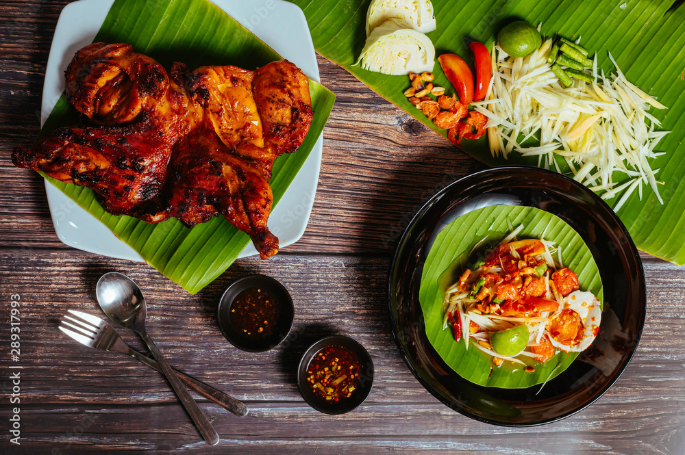 Thai food grilled chicken and salted egg papaya salad (somtum) The ...