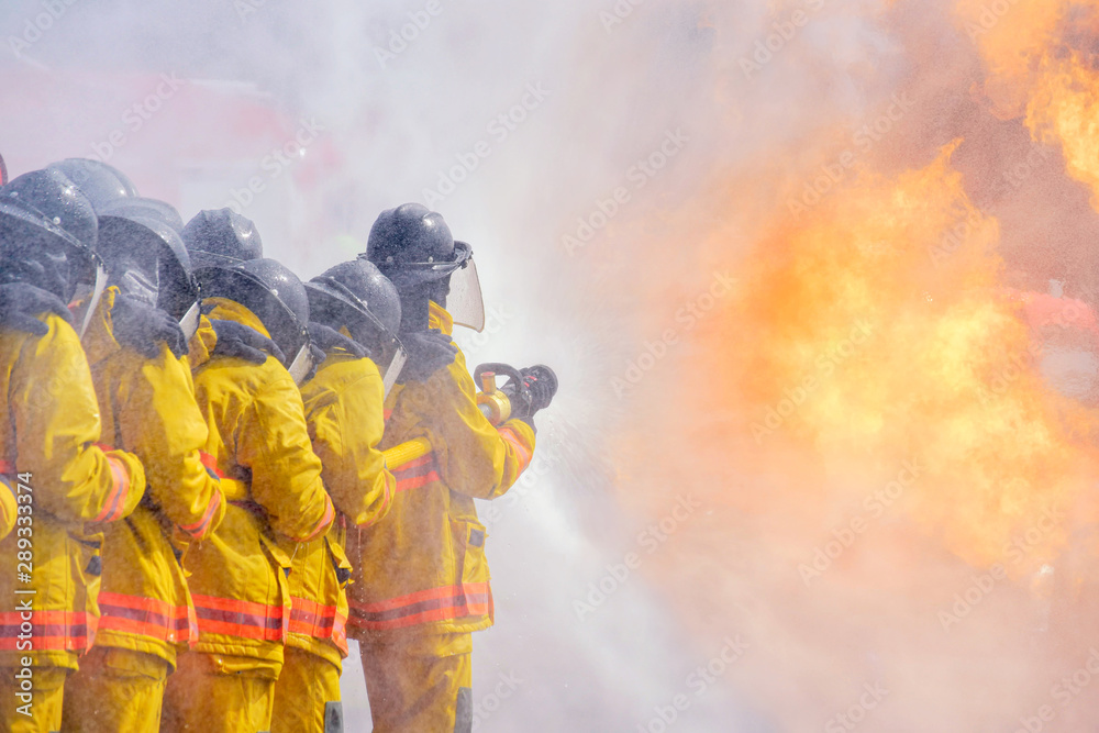Firefighters training, group of firefighters fighting a fire. .Fire ...