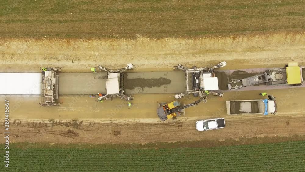 Fully mechanised process of concrete road construction. Concrete paving ...