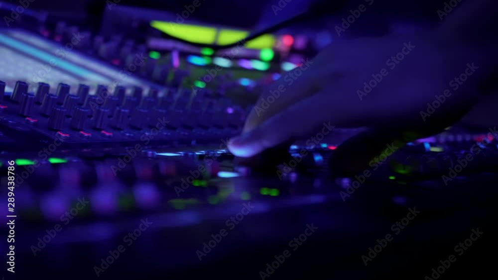 Remote control for adjusting the sound. Audio mixer. Sound engineer ...