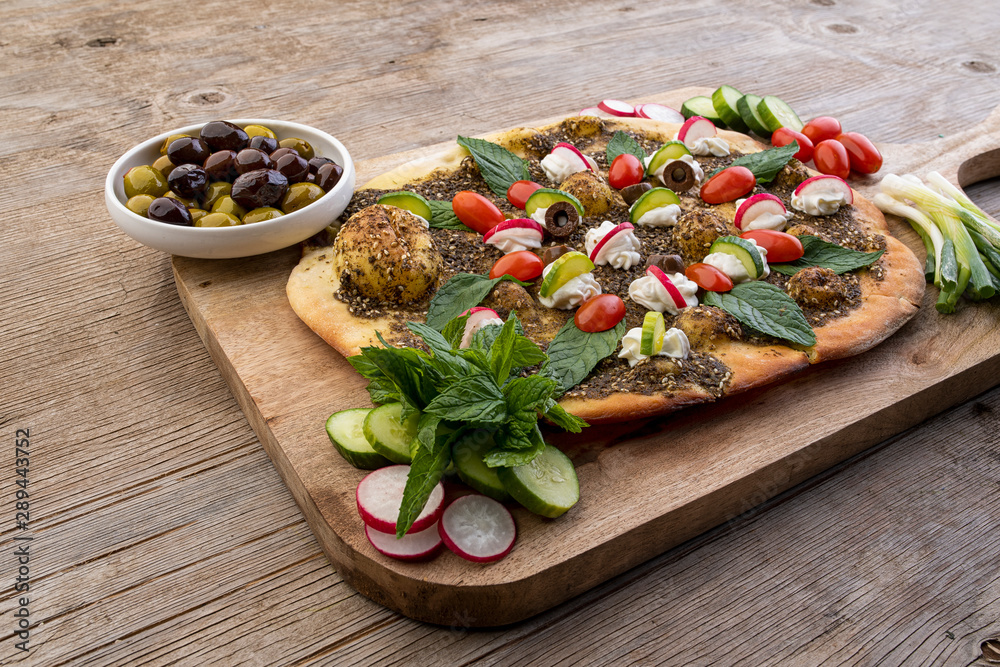 lebanese Manoushe ,bread of thyme topped with mint, reddish, and Labneh ...