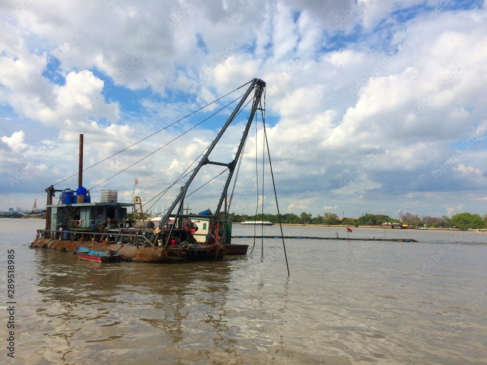 Dredger ,Dredging mud in the river for large boats to pass through ...