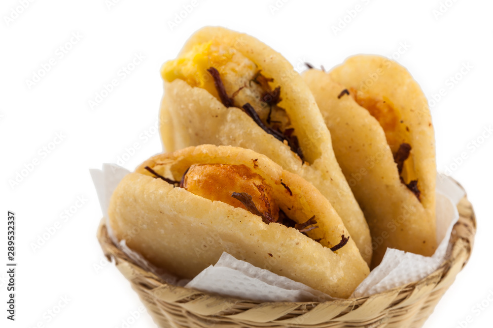 Arepa de huevo. Traditional Colombian fried arepa filled with egg and ...