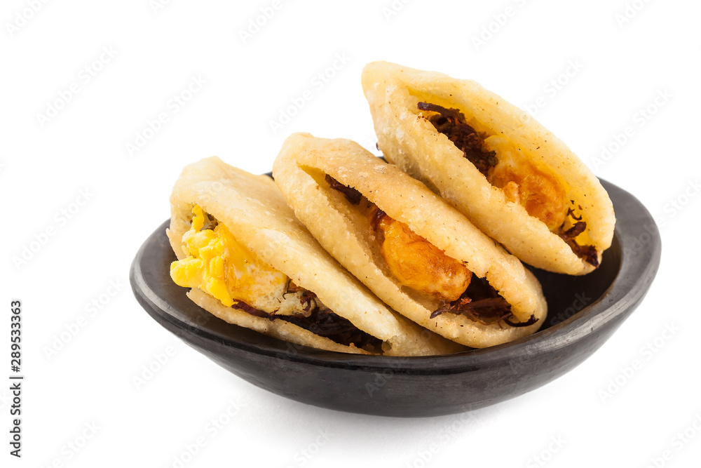 Arepa de huevo. Traditional Colombian fried arepa filled with egg and ...