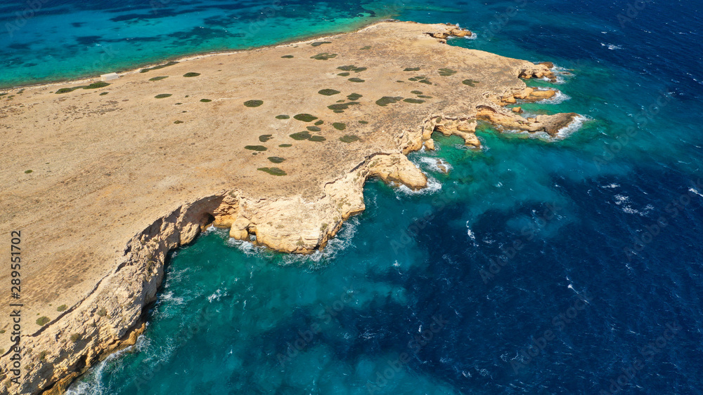 Aerial drone photo of small islet of Glaronisi with paradise emerald ...