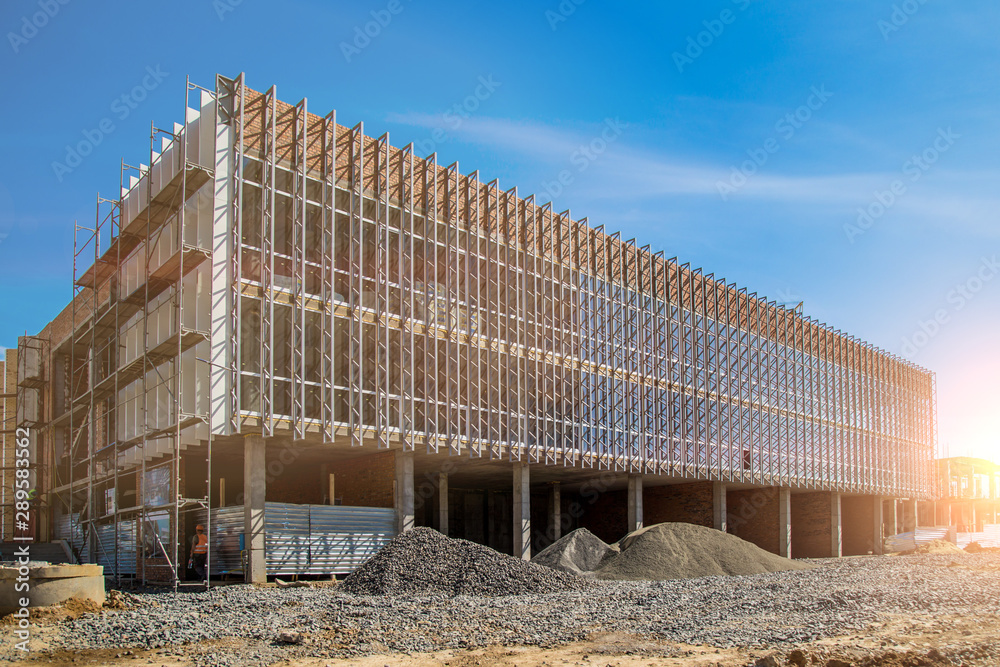 Construction site background. Hoisting cranes and new multi-storey ...