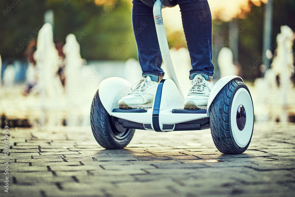 Human legs and feet on hoverboard park paths Stock Photo | Adobe Stock