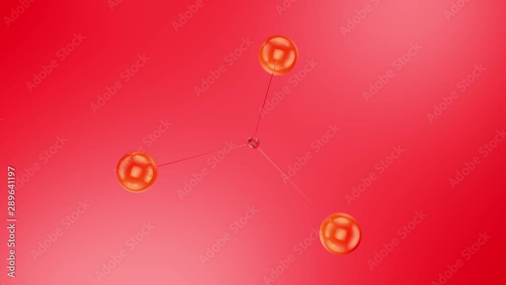 Pendulum back and forth movement of spheres on a glassy colorful ...