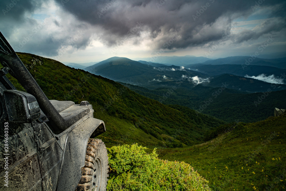 Extreme off road tour in a forest. Classic 4x4 car crossing water with ...
