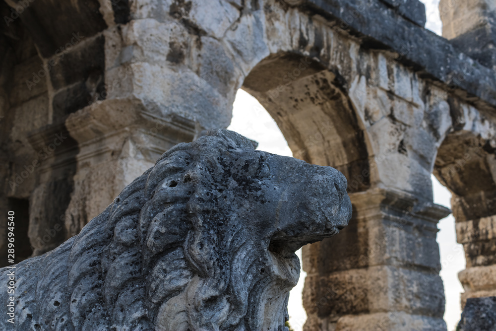 Lion statue inside the Pula Arena (Arena di Pola), famous Roman ...
