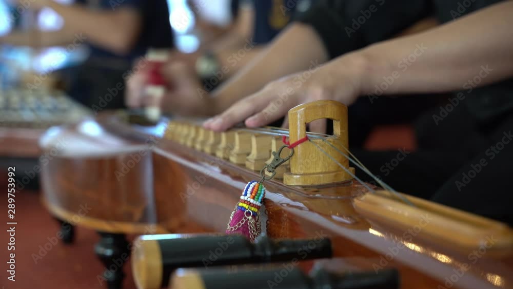 Close up hand is playing a Thai musical instrument. Thai musical ...