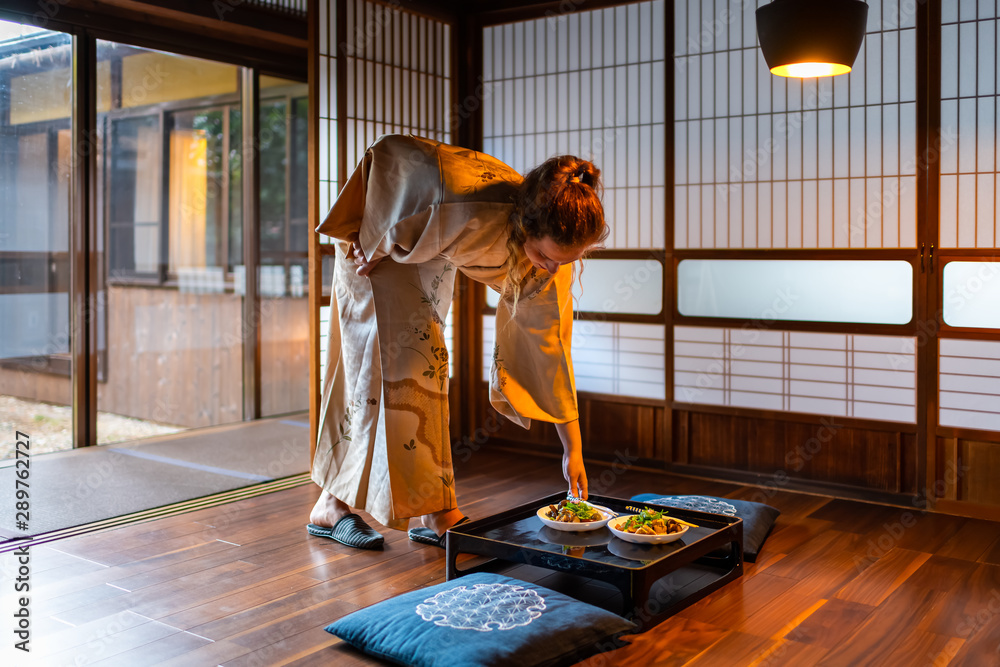 Traditional Japanese house or ryokan room with young foreigner woman ...