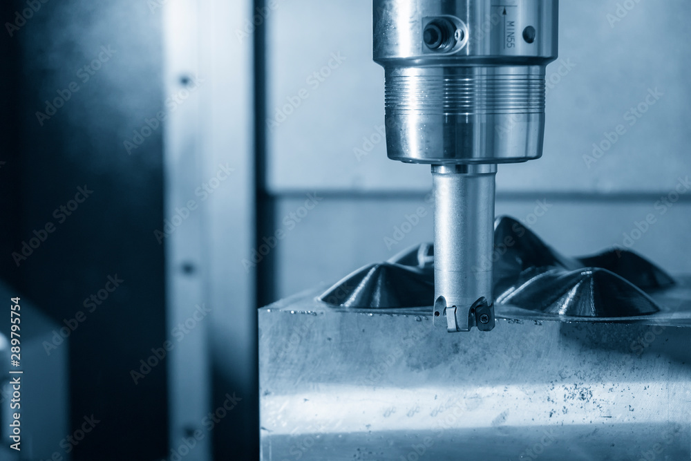 The CNC milling machine rough cutting the mould parts with the ...