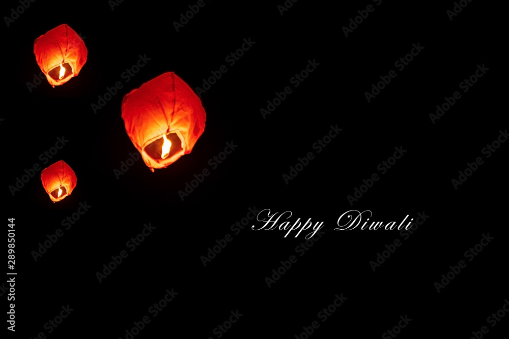 Happy Diwali - Fireflies Lantern. Diwali red sky Lanterns at night with ...