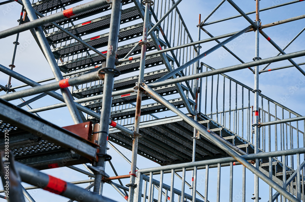 Metal scaffolding stairs on construction site Stock Photo | Adobe Stock