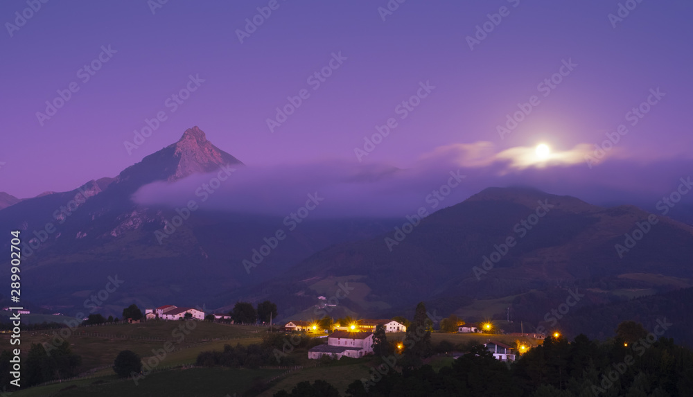 Dusk with a full moon in Lazkaomendi with the Sierra de Aralar and ...