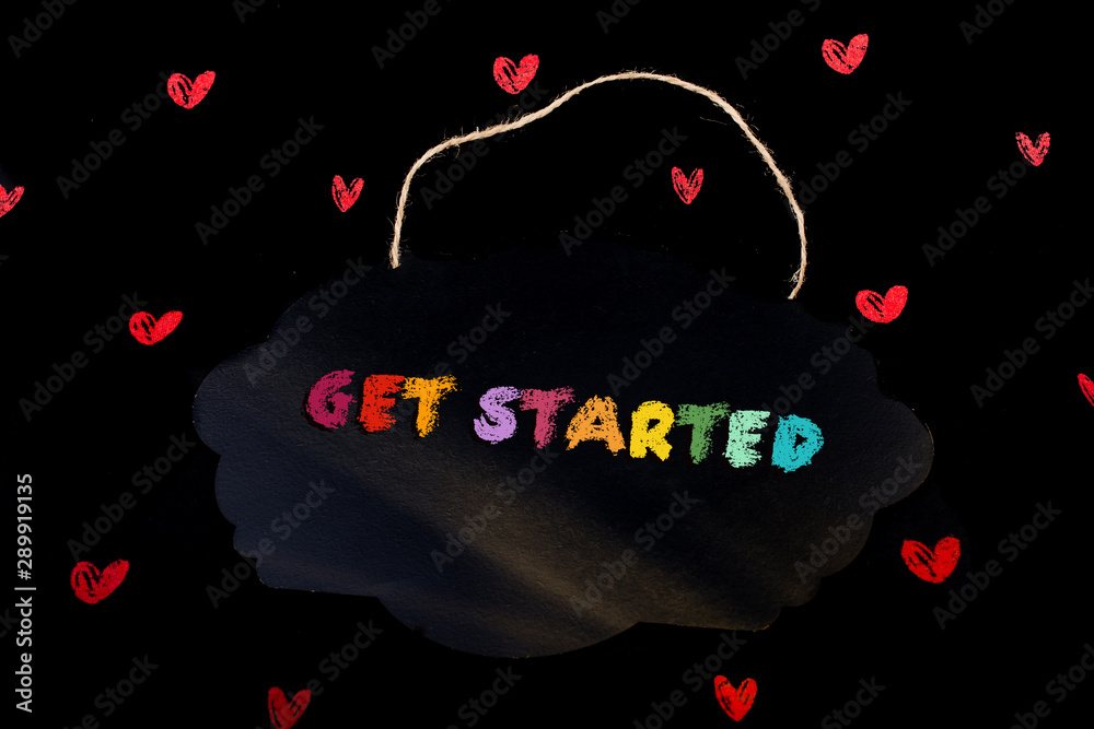 Get started wording written on blank sign board in hand Stock Photo ...