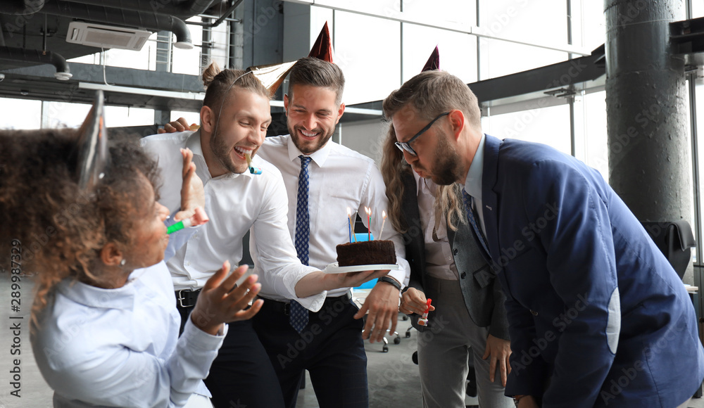 Business team celebrating a birthday of collegue in the modern office ...