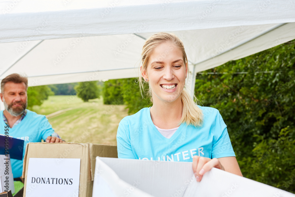 Young woman volunteering in volunteer Stock Photo | Adobe Stock