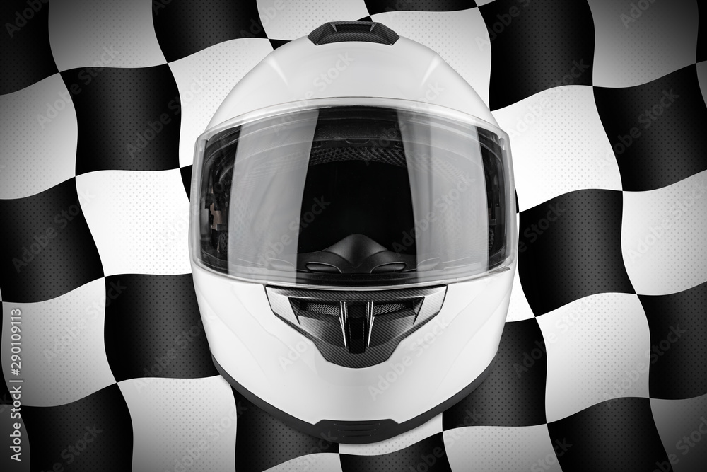 White motorcycle carbon integral crash helmet front of motorsport black ...