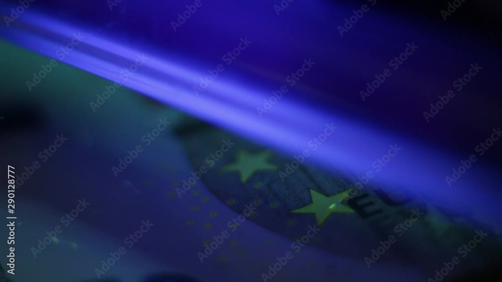 Close Up Of Euro Banknote And Ultraviolet UV Light Counterfeit Bill ...