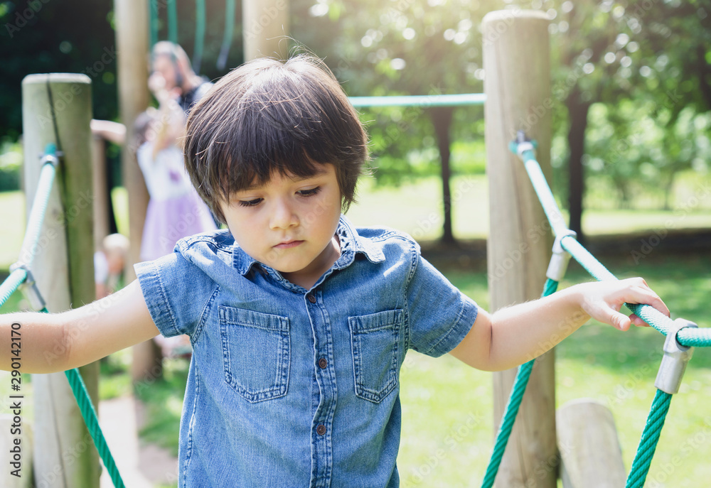 Sad Child Playing Alone
