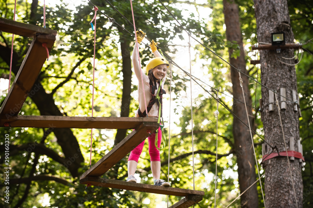 Happy Little girl climbing a tree. Go Ape Adventure. Hike and kids ...