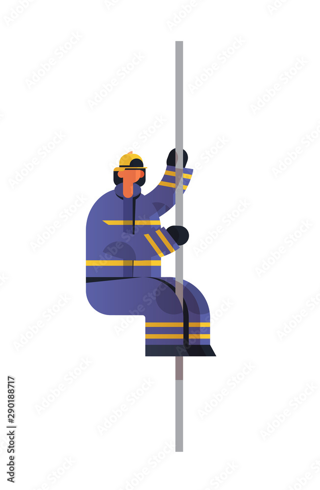brave fireman sliding down the pole of fire station firefighter wearing ...