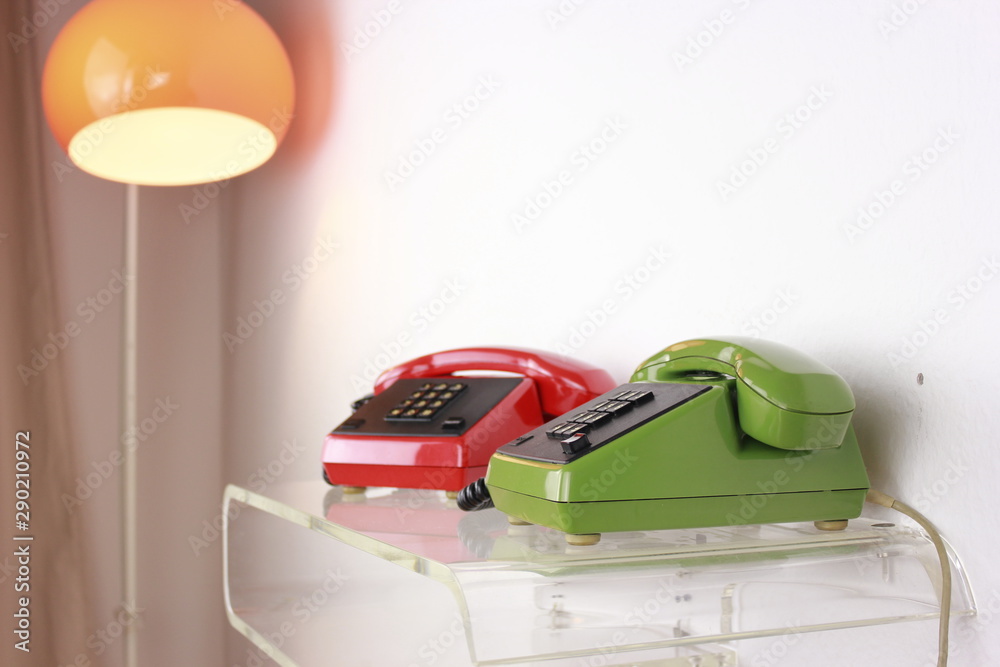 old antique telephone red green plastic isolated on white background ...