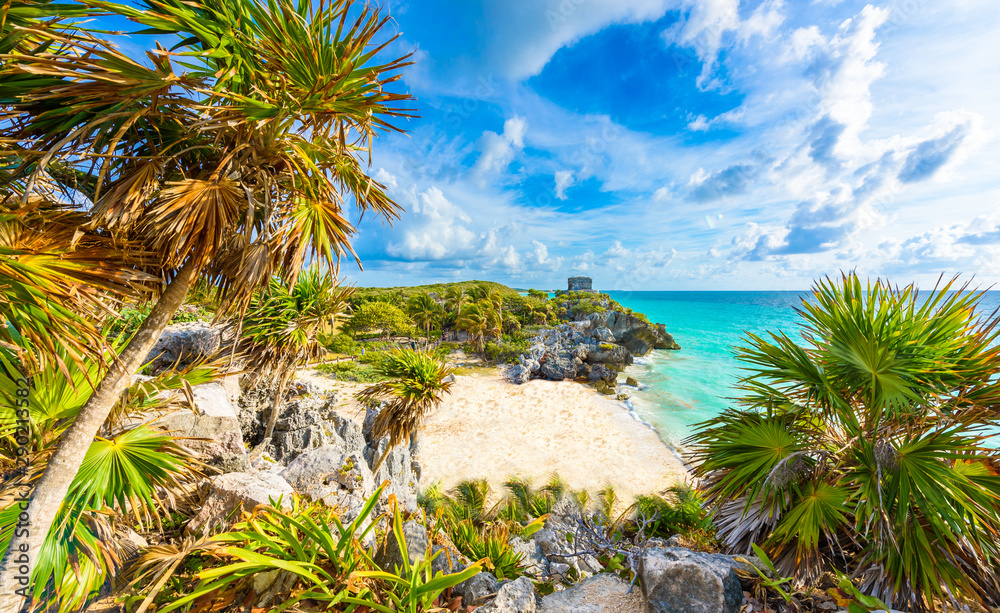 Mayan ruins of Tulum at tropical coast. God of Winds Temple at paradise ...