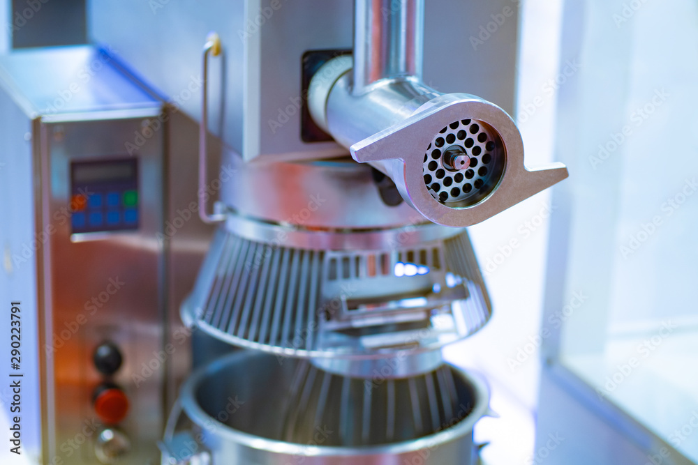 Industrial meat grinder with mixer close-up. Food industry. Kitchen ...