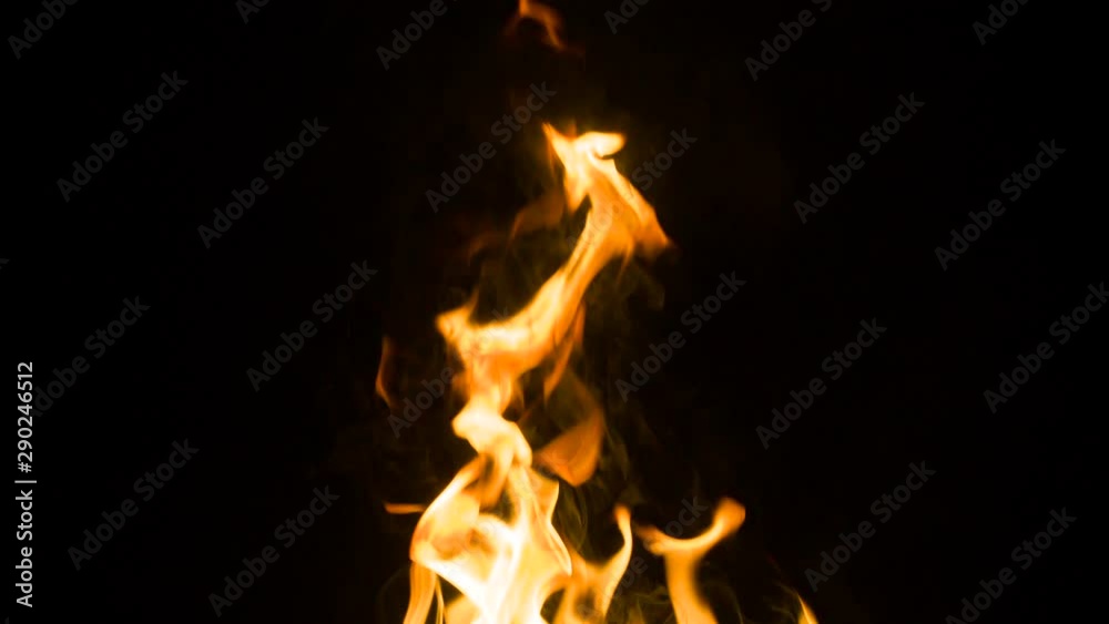 Fire Slowly Dies Away.Tongues of flame slowly soar up in the dark ...