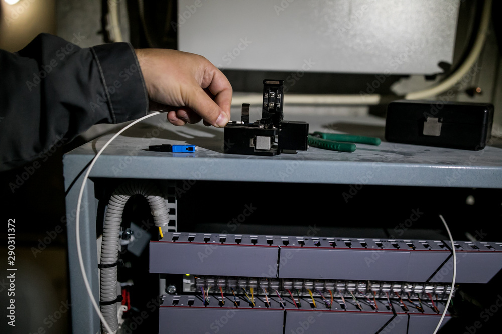 The technician attaching fiber optic on the Optical Distribution Frame ...