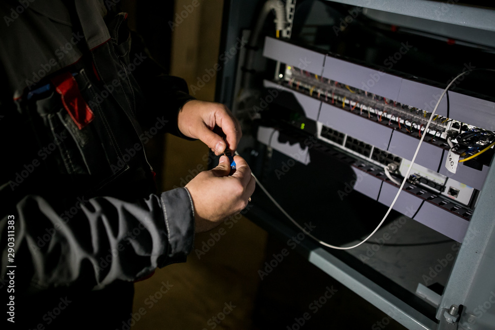 Foto de The technician attaching fiber optic on the Optical ...