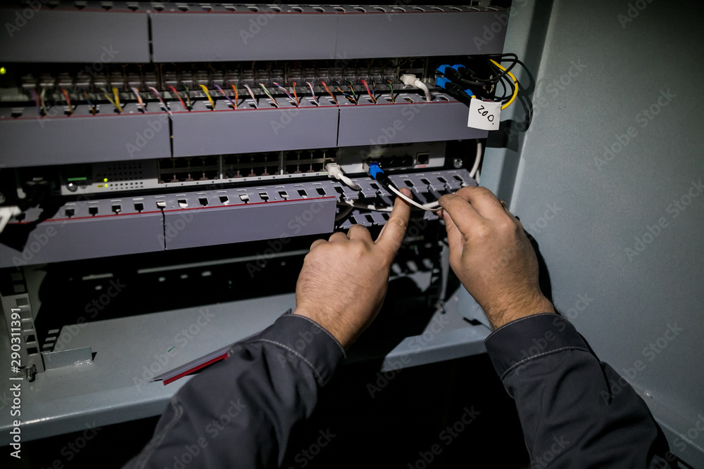 The technician attaching fiber optic on the Optical Distribution Frame ...