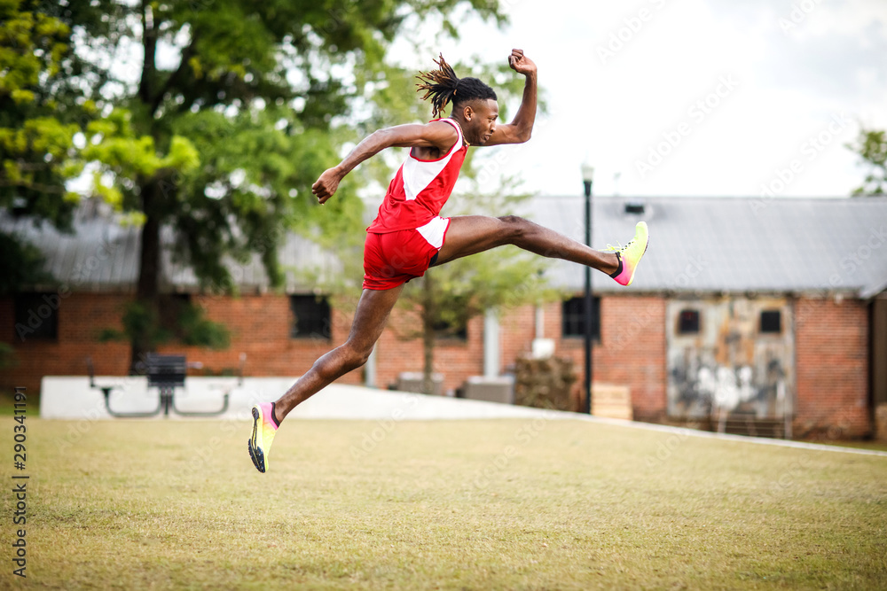 Young Handsome African American Black Male outside running in the field ...