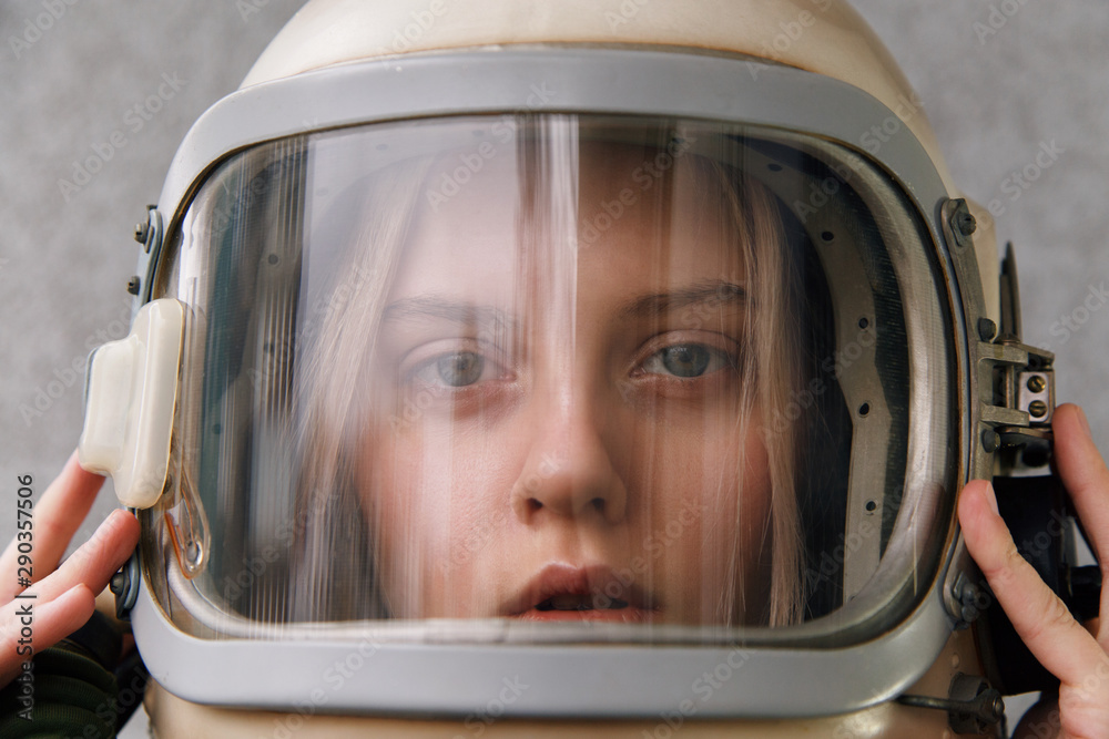 Sensual girl wearing retro space helmet Stock Photo | Adobe Stock