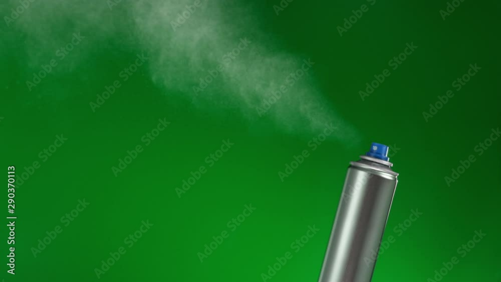 spray can on green background sprays fountain of vaporized foam ...