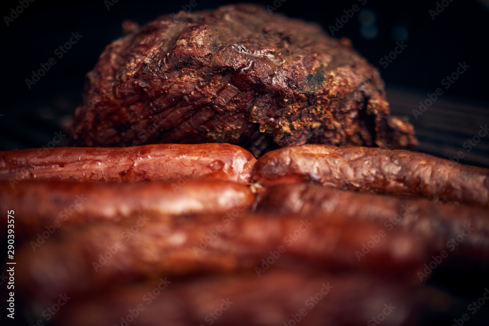 Grilled meats over the barbecue fire. You can see the smoke, the fire ...
