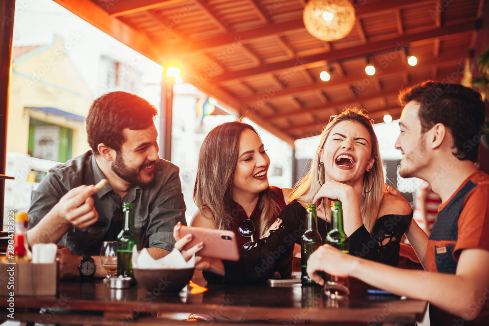 Group Of Friends Having Fun At Bar