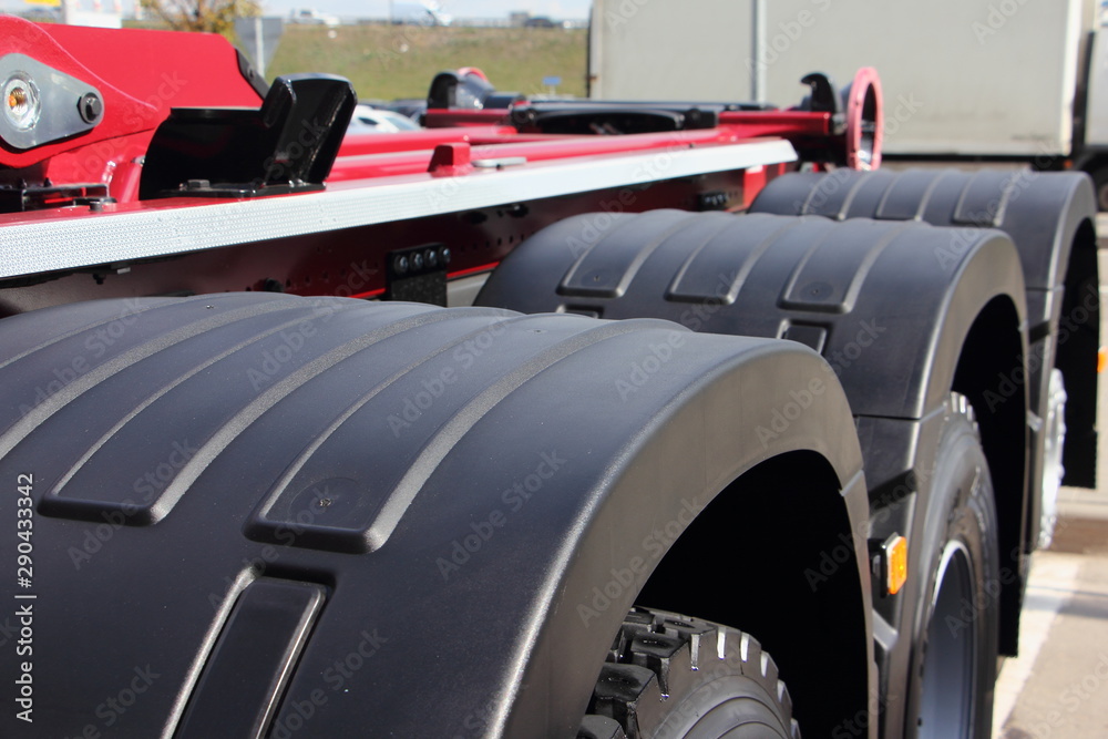 New three-axle cargo container truck with platform close up, freight ...